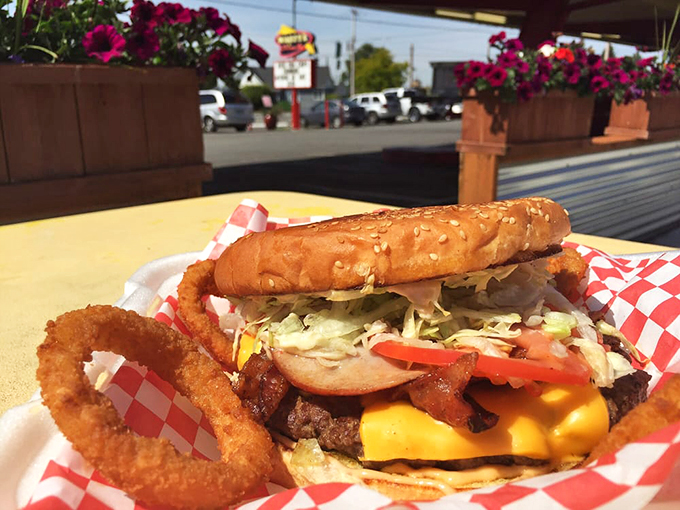 Behold the perfect outdoor meal: a juicy burger and golden onion ring basking in the Washington sunshine like they're on vacation.