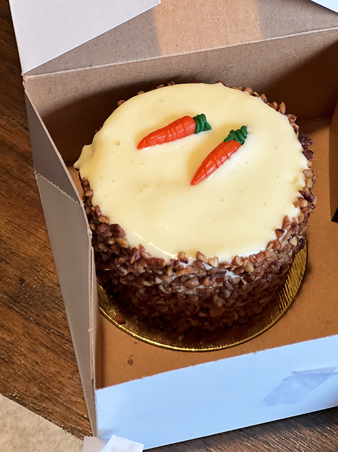 The legendary carrot cake, adorned with tiny marzipan carrots, isn't just dessert&mdash;it's edible architecture. The cream cheese frosting gleams like the Holy Grail of pastry perfection. 