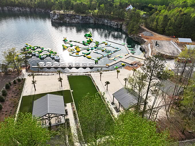 Bird's eye bliss! From above, Fantasy Lake's inflatable playground resembles a giant's game of Tetris, floating serenely on crystal-clear waters surrounded by Carolina greenery.