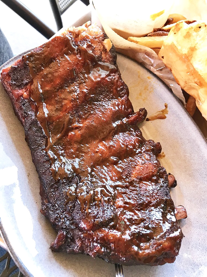 These ribs don't just fall off the bone&mdash;they practically leap into your mouth, their mahogany bark glistening with a promise that's about to be deliciously kept.