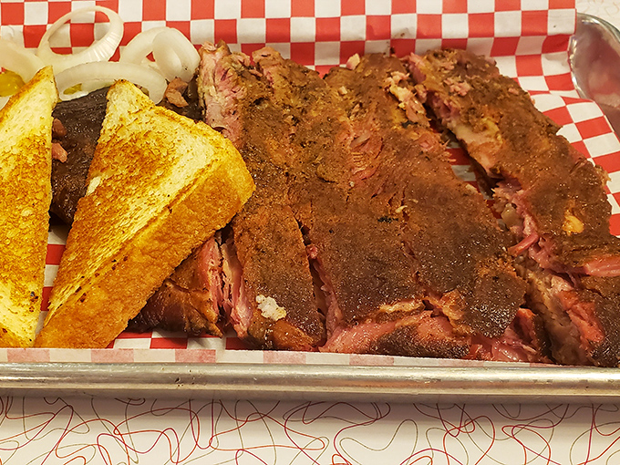 Brisket with that telltale pink smoke ring&mdash;barbecue's equivalent of Olympic gold. The bark on this beauty has more character than most Hollywood scripts.