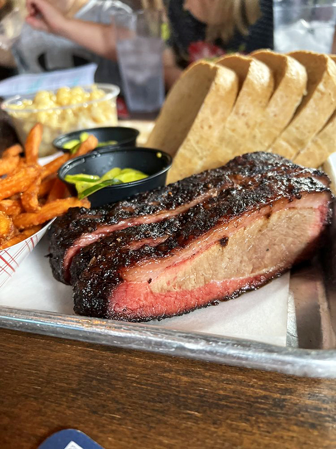 Behold the holy grail of barbecue: perfectly smoked brisket with that coveted pink smoke ring and bark that would make tree surgeons jealous.