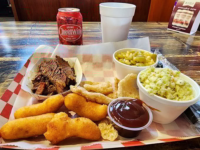 The BBQ platter arrives like a Southern hostess—generous, welcoming, and unafraid to show off the golden hush puppies that steal the show.