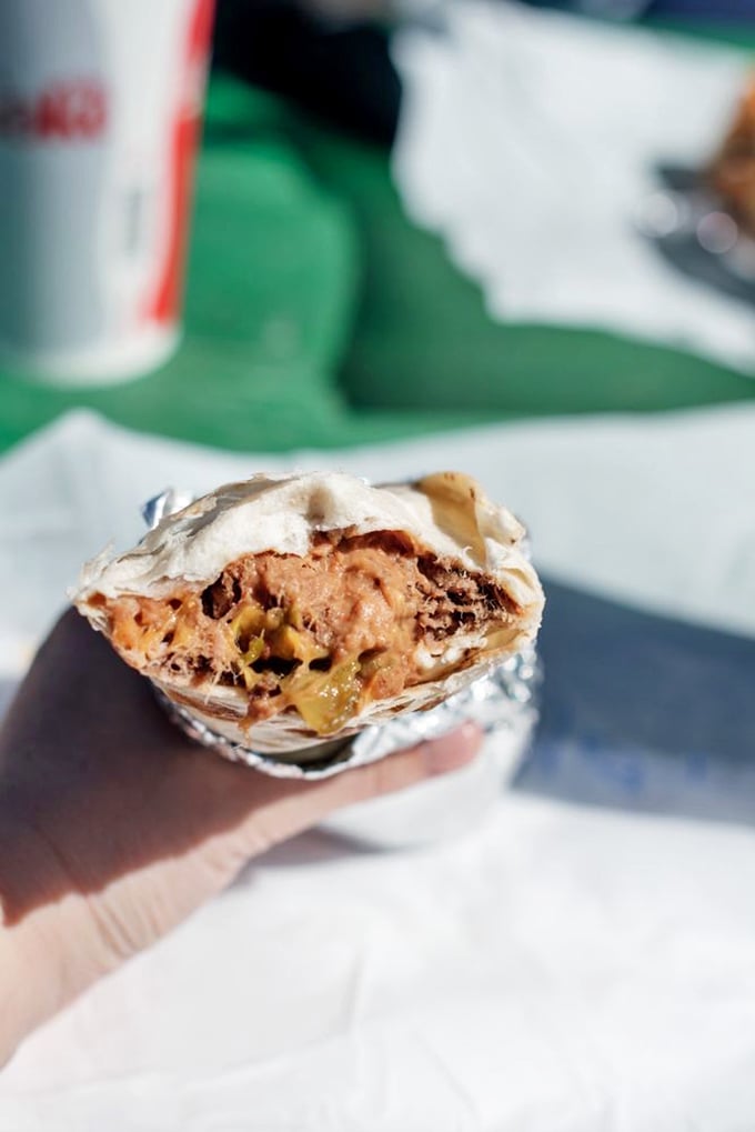 That moment when the burrito reveals its soul &ndash; layers of spicy, savory goodness that make you wonder why you'd ever eat anything else.