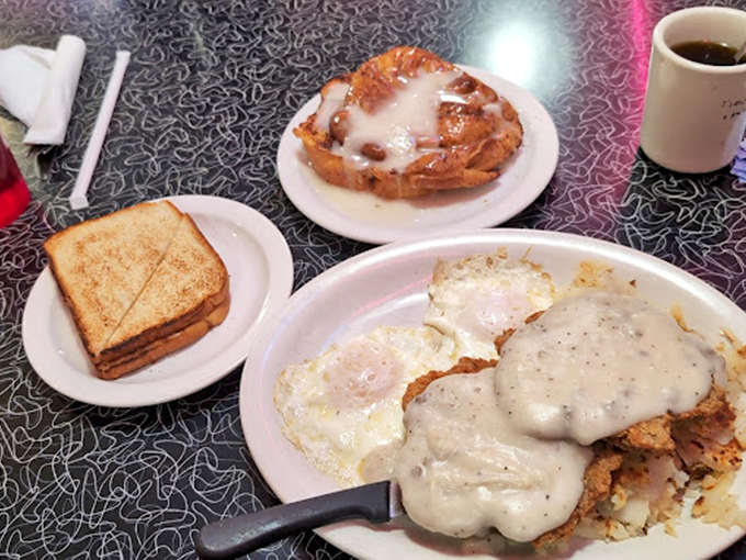 Biscuits and gravy that would make your grandmother both proud and jealous. That pool of creamy gravy isn't messing around.