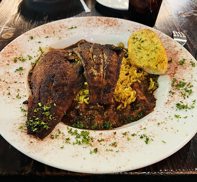 Blackened redfish that could convert non-believers &ndash; mahogany-crusted spices giving way to tender fish beneath, served atop dirty rice worthy of worship.