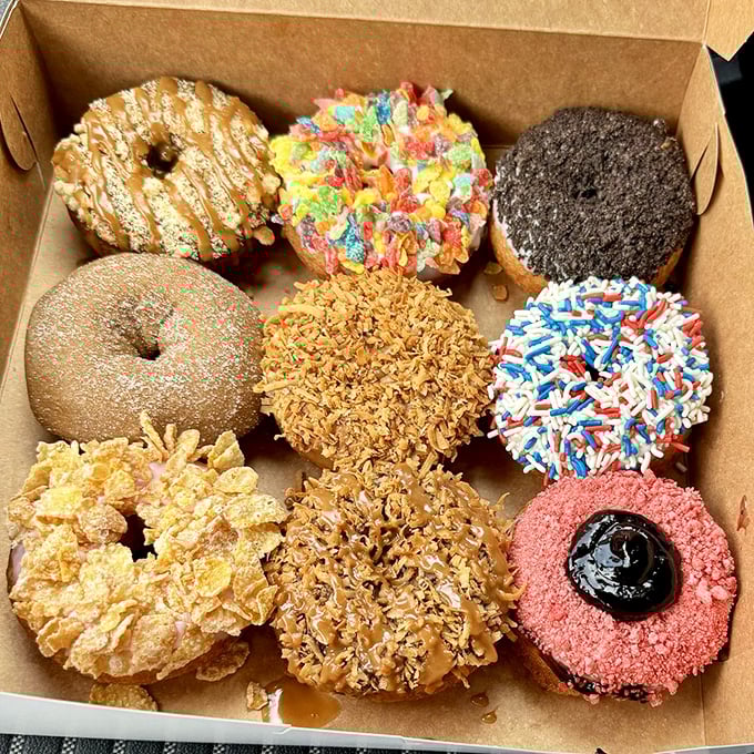 Behold the box of dreams! Nine distinct personalities of fried dough, each one beckoning with its own special combination of toppings.