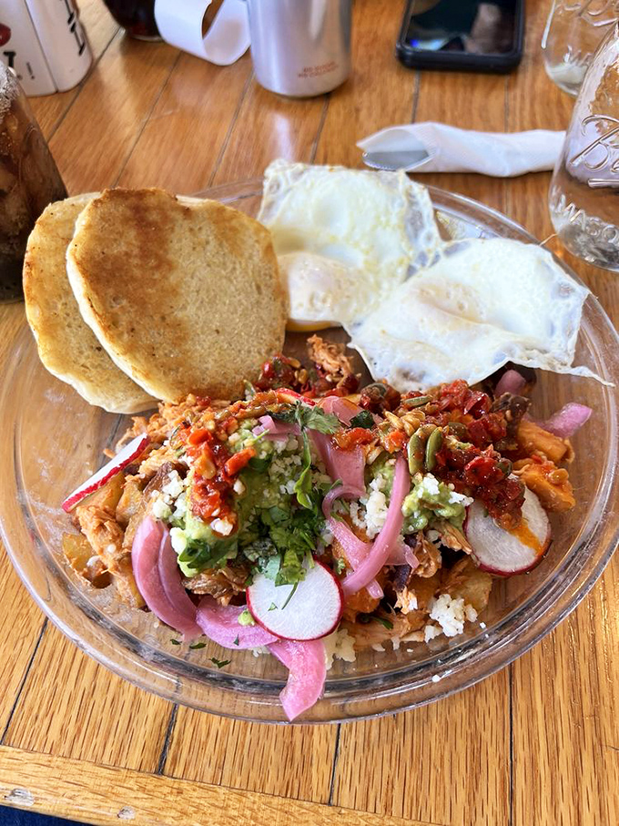 Breakfast artistry that makes you question why you ever settled for cereal. Those pickled red onions are the jewelry this dish deserves.