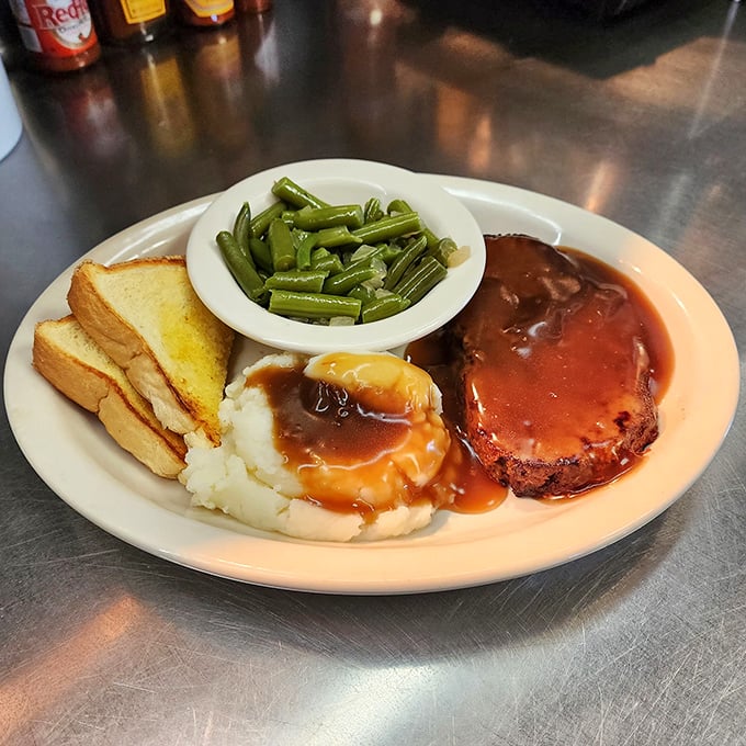 Meatloaf that doesn't just sit on the plate&mdash;it commands respect. That glossy tomato glaze is the crown jewel of comfort cuisine.