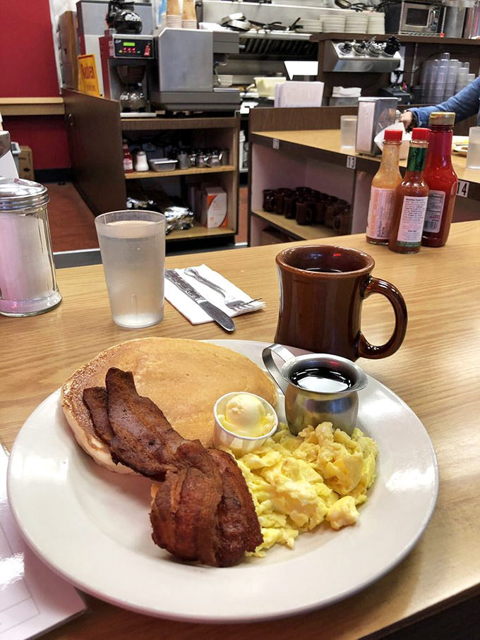 The holy trinity of breakfast perfection: a fluffy omelet, crispy hash browns, and toast that's achieved that magical golden-brown sweet spot.