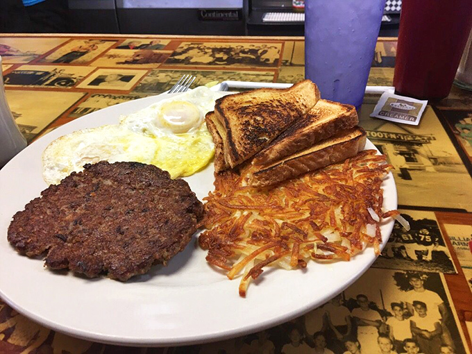 Breakfast of champions: a hamburger steak that's seen the griddle's sweet spot, eggs with perfect sunny centers, and hashbrowns that crackle with each bite.