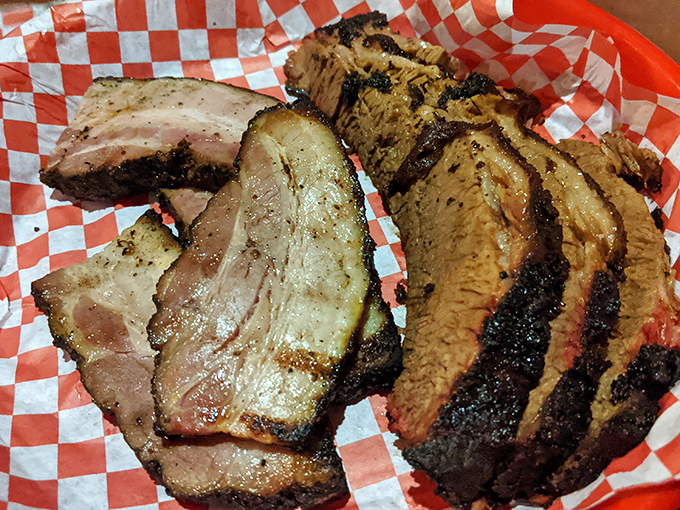 Brisket so tender, it practically melts on your plate! This smoky masterpiece is the BBQ equivalent of a warm hug for your stomach.