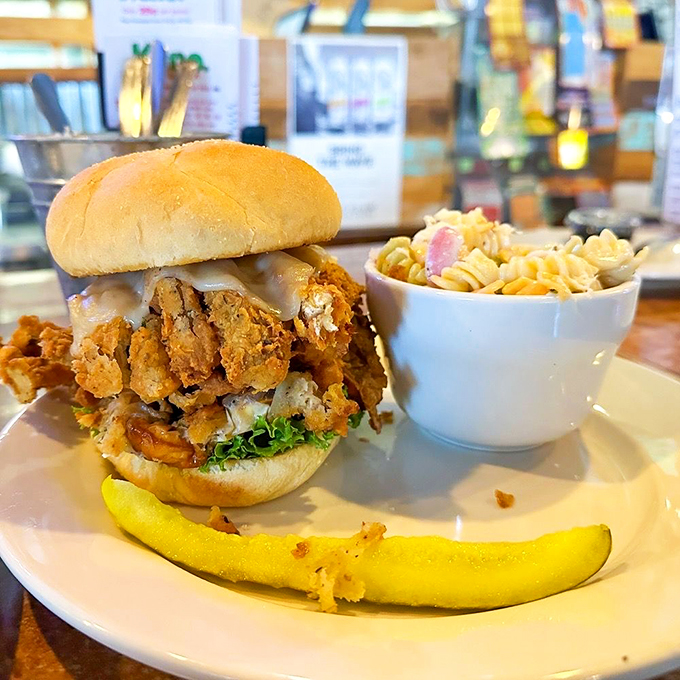 This isn't just a sandwich; it's a tower of crispy fried seafood defying gravity and good manners. Worth every napkin.