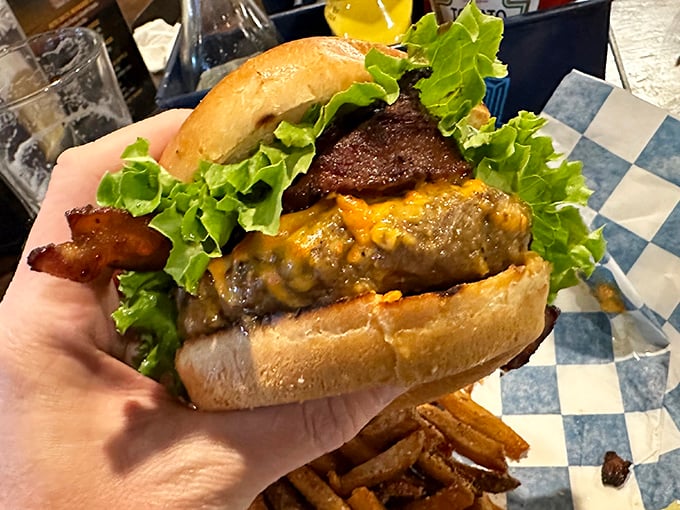 Behold the burger in its natural habitat &ndash; juicy, cheese-laden, and requiring both hands and possibly a bib.