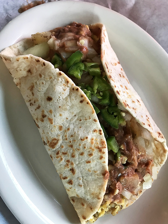 This isn't just a taco&mdash;it's edible architecture. Notice how the green chilies peek out like they're saying "just you wait."