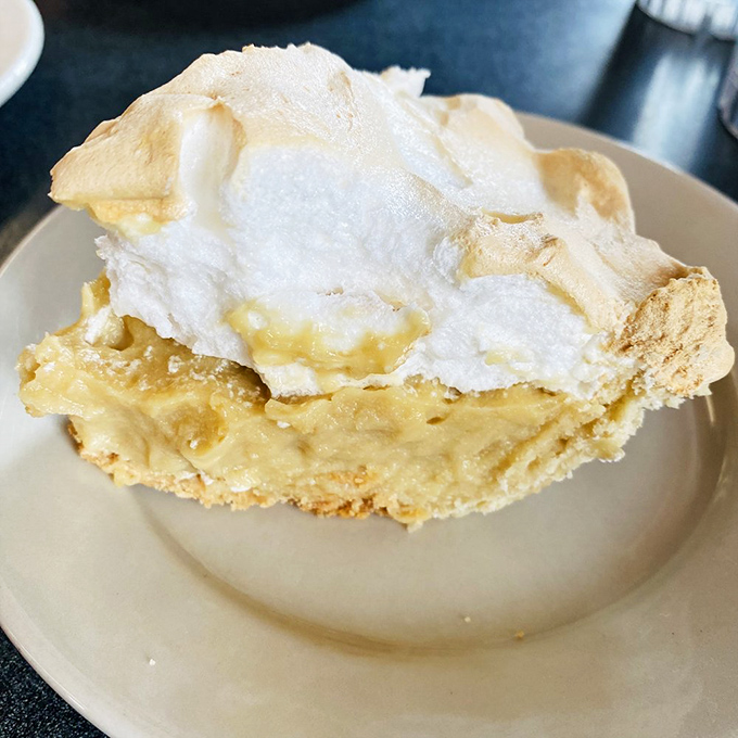 Butterscotch pie that would make your grandmother weep with joy. That golden custard filling sits somewhere between dessert and a religious experience.