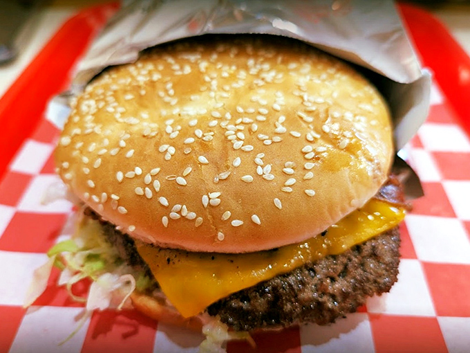 This isn't just a cheeseburger; it's a masterpiece of beef, cheese, and fresh veggies that demands to be photographed before devoured. 