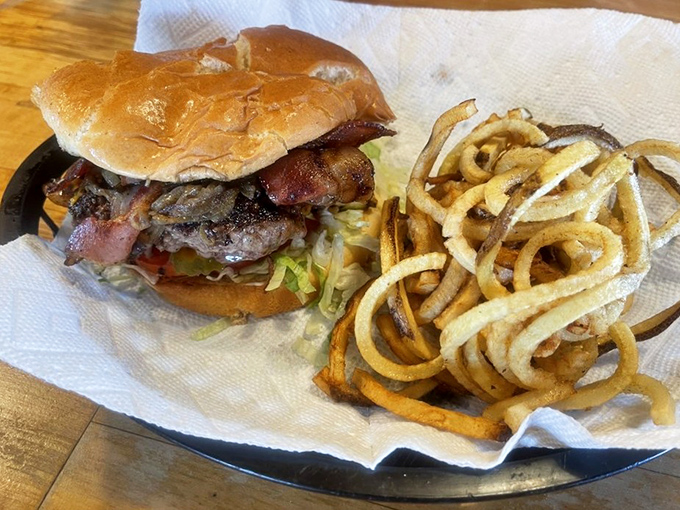 This isn't just a burger&mdash;it's an architectural marvel of beef, cheese, and toppings that requires both hands and several napkins.