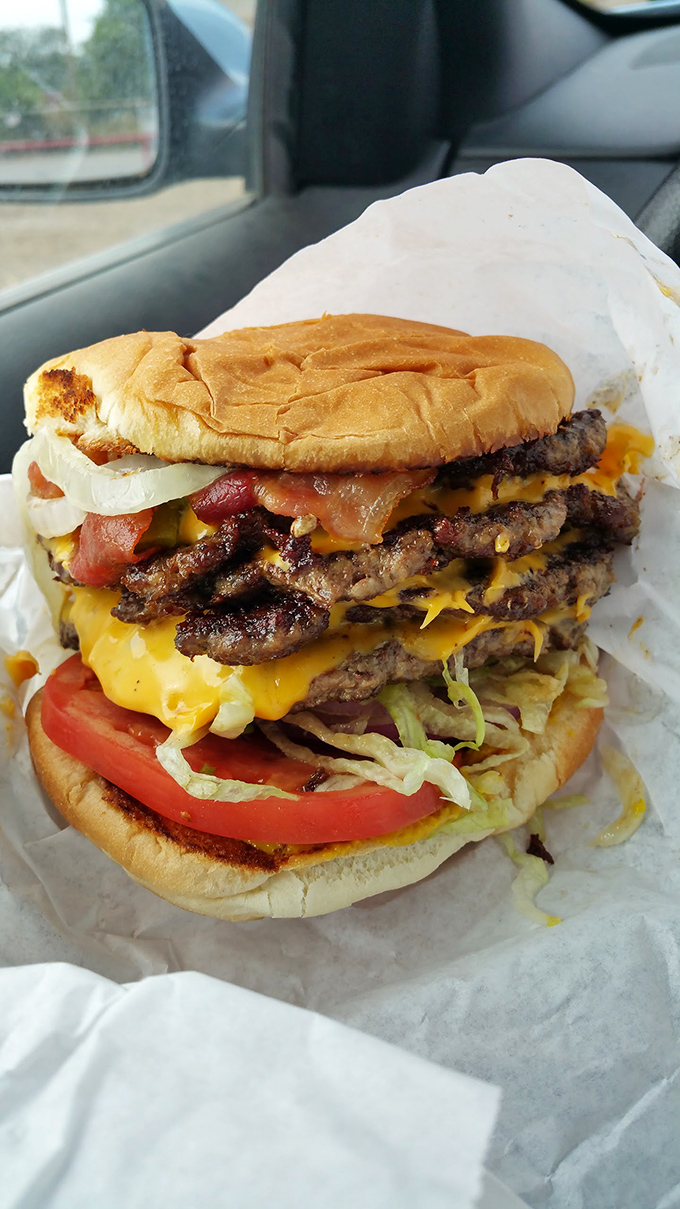 Behold the architectural marvel that is Hometown's triple cheeseburger&mdash;where beef, cheese, and fresh veggies create the Taj Mahal of handheld meals.