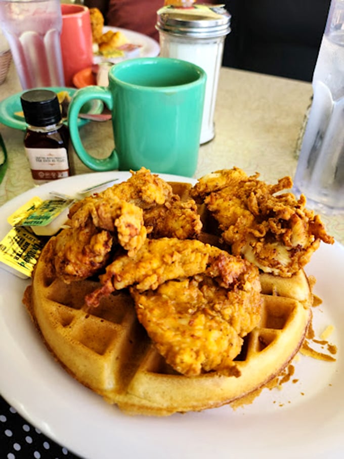 Chicken and waffles: where crispy, golden-brown poultry meets fluffy waffle in a marriage so perfect it makes you question why anyone would ever eat them separately.