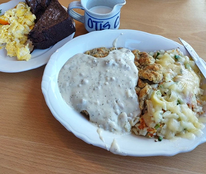 The legendary chicken fried steak, blanketed in peppery country gravy that cascades like a savory waterfall over crispy, golden perfection. This is what dreams are made of. 
