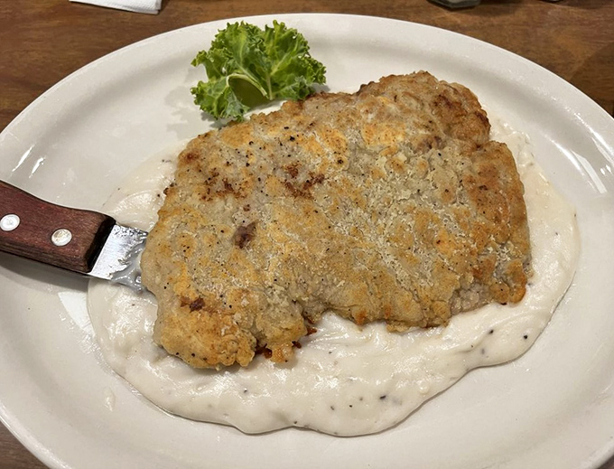 Golden-crusted chicken fried steak swimming in peppery cream gravy&mdash;proof that sometimes the most beautiful things in life aren't the most photogenic.