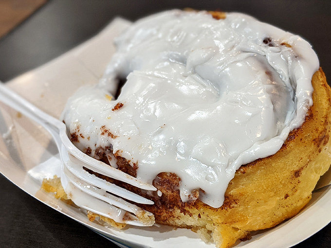 This cinnamon roll isn't just breakfast; it's an event. That glorious icing doesn't drip&mdash;it cascades with the confidence of a waterfall in a shampoo commercial.