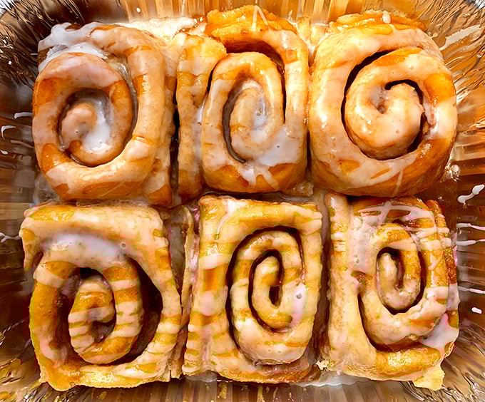 Six perfect spirals of doughy delight, each one a testament to the art of patience. Resistance is futile, just accept your delicious fate.