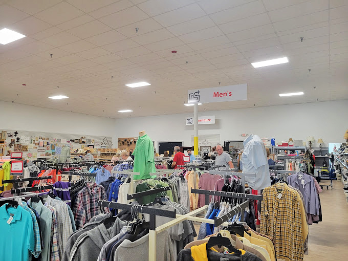 The Men's department stands ready with a rainbow of button-downs and casual wear, each garment with tales to tell from previous lives.