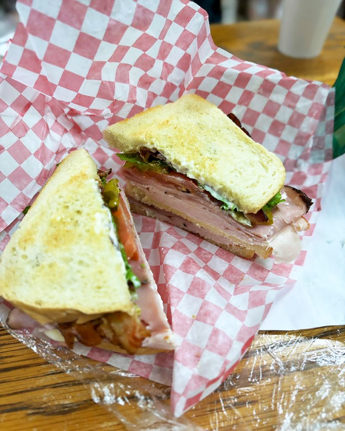 Architecture matters in sandwiches too. This club's perfect layering would make Frank Lloyd Wright weep with joy and immediately order seconds.