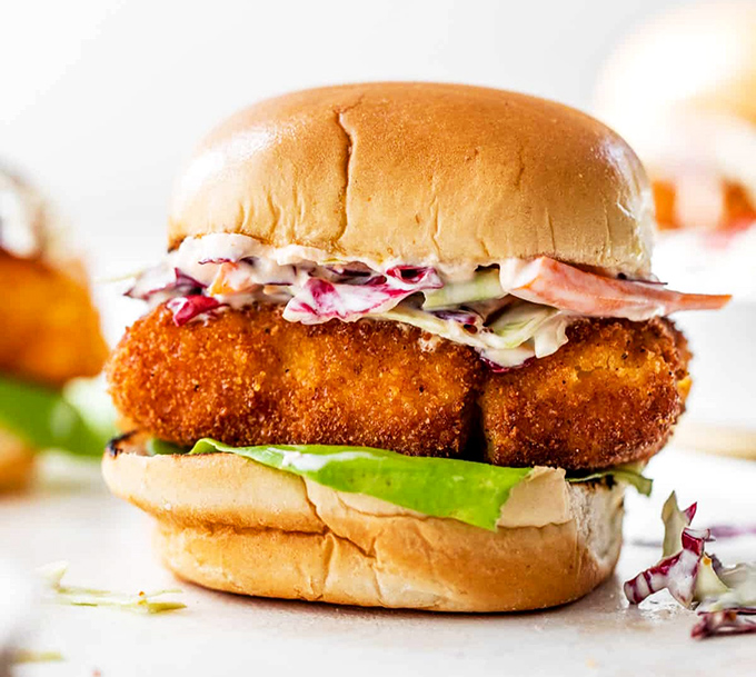 The holy grail of fish sandwiches! Golden-battered cod tucked into a pillowy bun with crisp veggies and sauces that'll make your taste buds sing sea shanties.