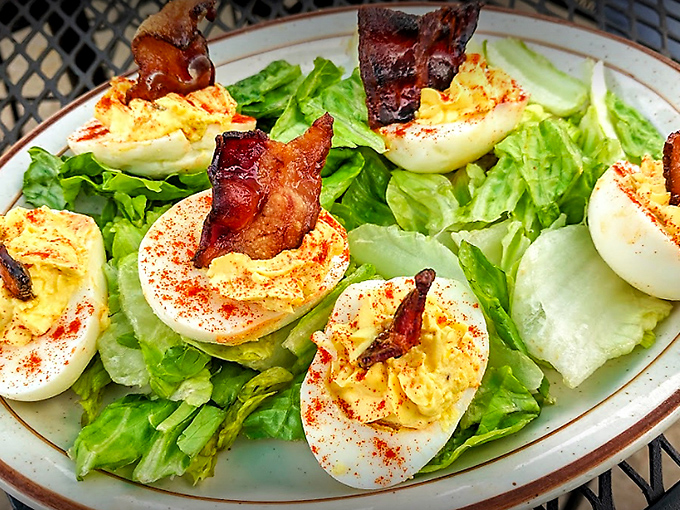 Not your grandmother's deviled eggs (unless your grandmother was a culinary genius). These bacon-topped beauties are the reason some folks cross county lines.