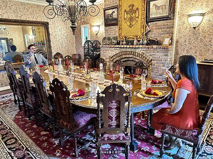 Dinner is served! This regal dining room, with its ornate chairs and elegant table settings, promises meals fit for royalty amid historic-inspired surroundings.