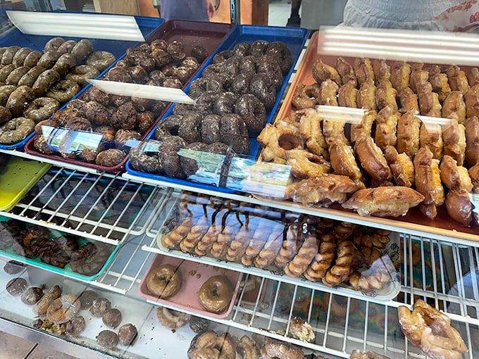 The glass case at Gibson's serves as a museum of edible art, each tray displaying another reason why willpower comes here to die.