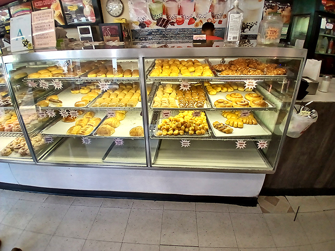 Donut display cases: the adult version of pressing your nose against a toy store window. Pure, unadulterated temptation under glass.