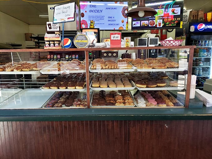 Trays of handcrafted treasures await behind glass, each shelf a different chapter in the story of breakfast bliss.