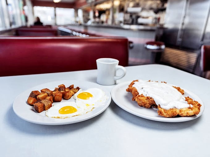 Sunny-side up eggs and golden hash browns share the plate with country-fried steak smothered in creamy gravy&mdash;breakfast of champions, Midwest edition.