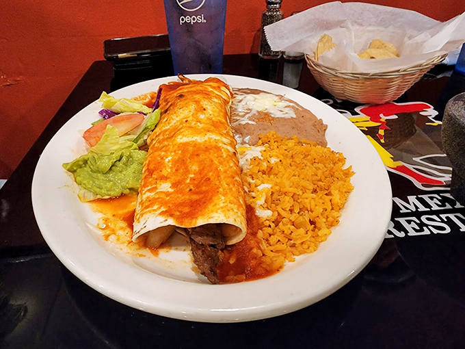 Holy guacamole! This enchilada platter is so loaded, it could moonlight as a weightlifting champion.