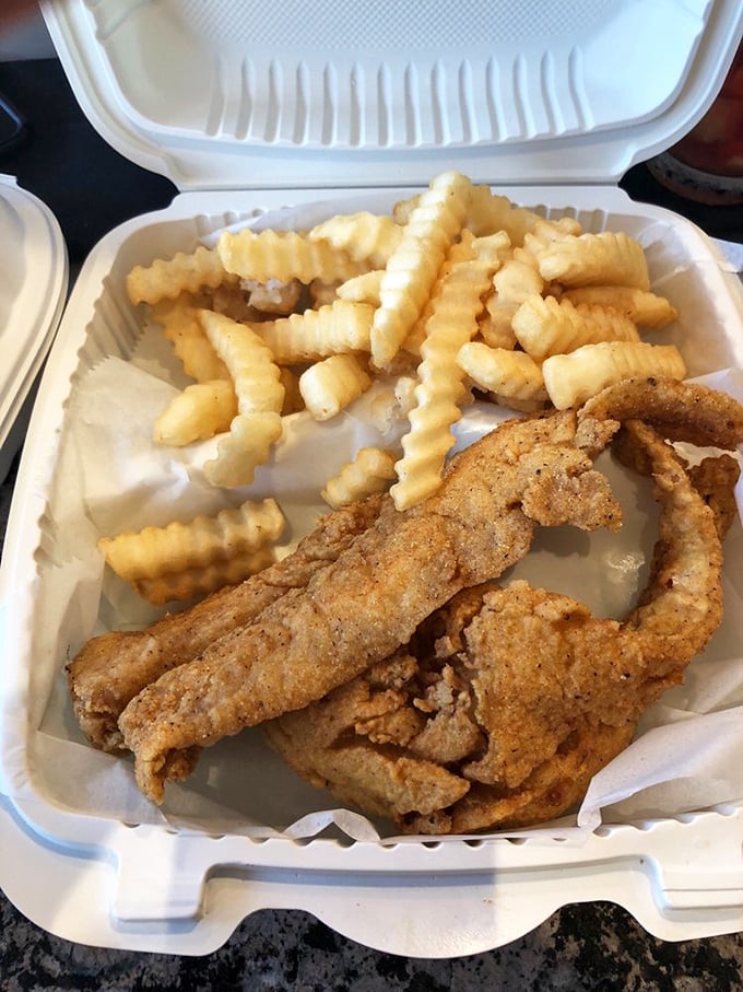 Golden-battered fish nestled against crinkle-cut fries &ndash; the seafood equivalent of a perfect hug. Comfort food that speaks fluent Marylander.
