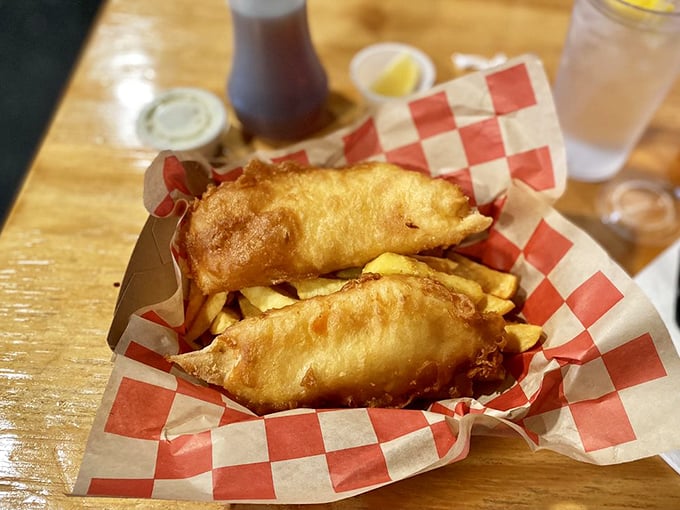 Golden-battered fish perched atop a bed of chips &ndash; this isn't just food, it's edible architecture that crackles with each heavenly bite.