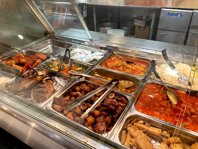 This hot food station isn't just serving lunch; it's offering a direct portal to abuela's kitchen, where everything simmers with tradition and love.