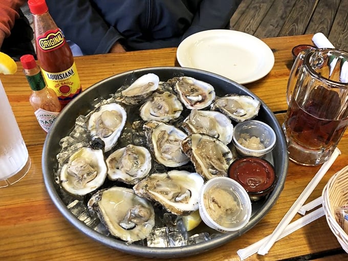 These oysters aren't just fresh; they're having a better day than most of us, lounging on ice while awaiting their lemon bath.
