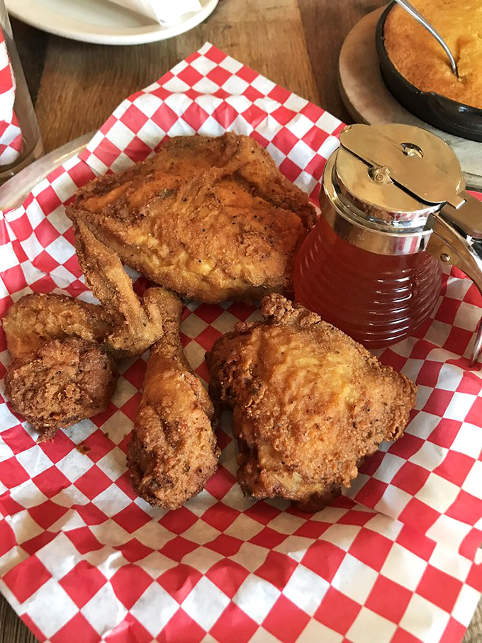 Golden-brown perfection on a red-checkered throne. That honey dispenser isn't just an accessory&mdash;it's about to become your new best friend.