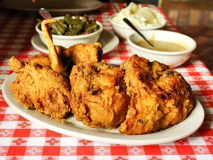 Golden-crusted perfection that makes first-timers gasp and regulars nod knowingly &ndash; this isn't just fried chicken, it's edible nostalgia.