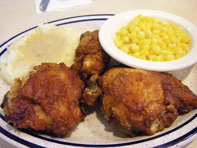 Golden-brown perfection meets cloud-like mashed potatoes. This chicken didn't just cross the road—it achieved culinary immortality.