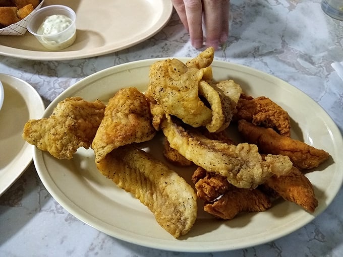 Golden-fried flounder that shatters like glass with each bite, revealing tender, flaky fish within. This is what seafood fantasies are made of.