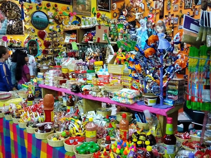 Color explosion! This booth looks like what would happen if a pi&ntilde;ata and a convenience store had a baby&mdash;deliciously chaotic.