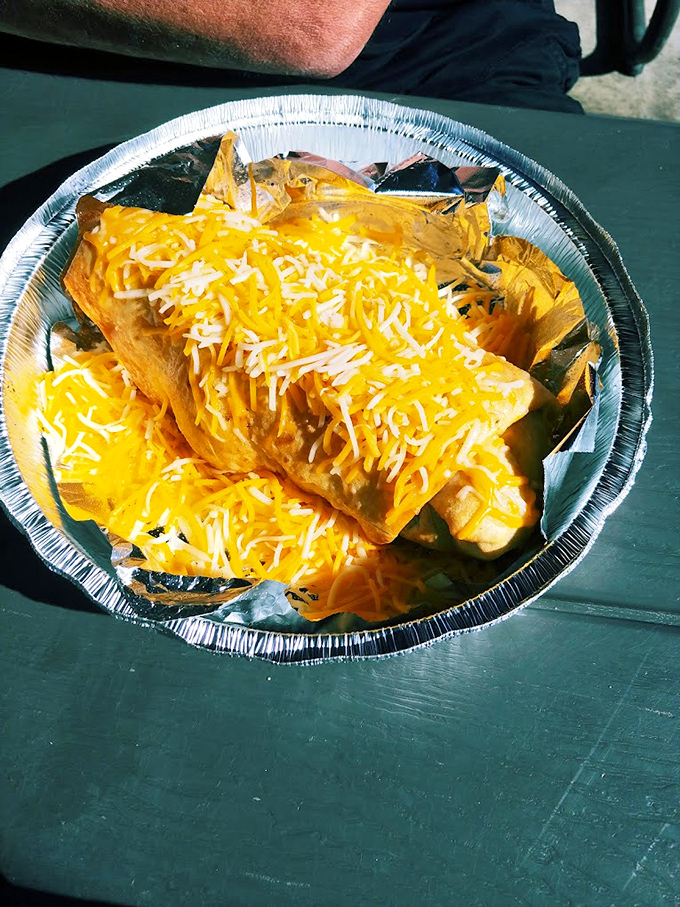 Cheese blankets these nachos like a cozy southwestern sunset, promising a crunch-and-melt experience that'll haunt your food dreams.