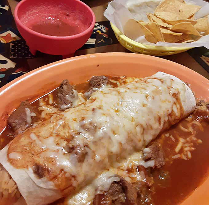 Behold the burrito in its natural habitat&mdash;swimming in a sauce so good you'll want to write it into your will.