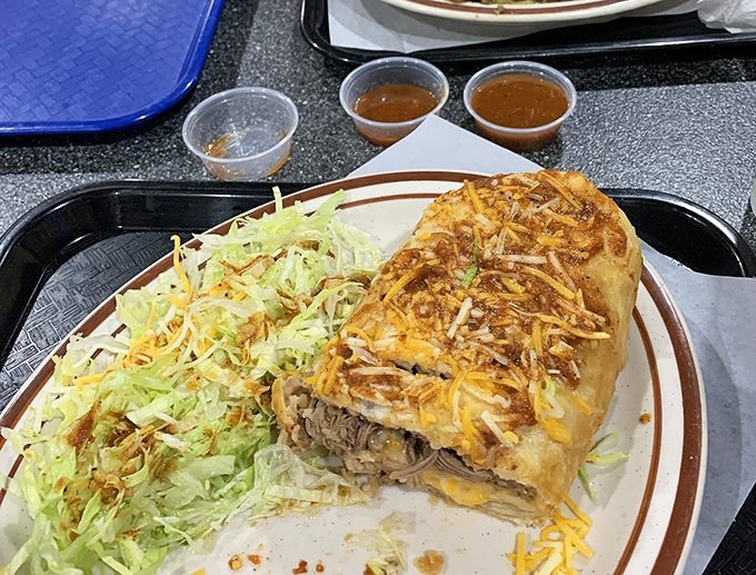 This isn't just a burrito &ndash; it's architecture, chemistry, and art wrapped in a tortilla. Note the perfect cheese-to-filling ratio and that mountain of shredded lettuce.